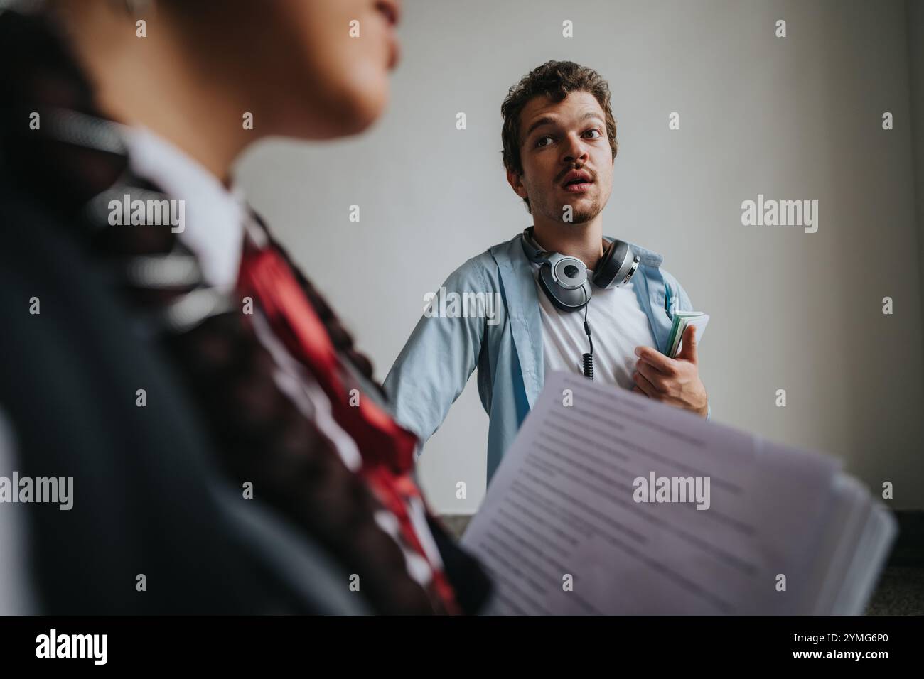 College students engaging with professor in outdoor setting Stock Photo - Alamy