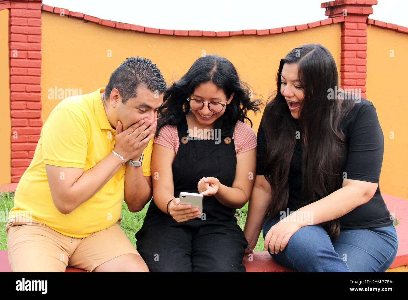 Latin dad and mom check their brunette teenage daughter's cell phone ...
