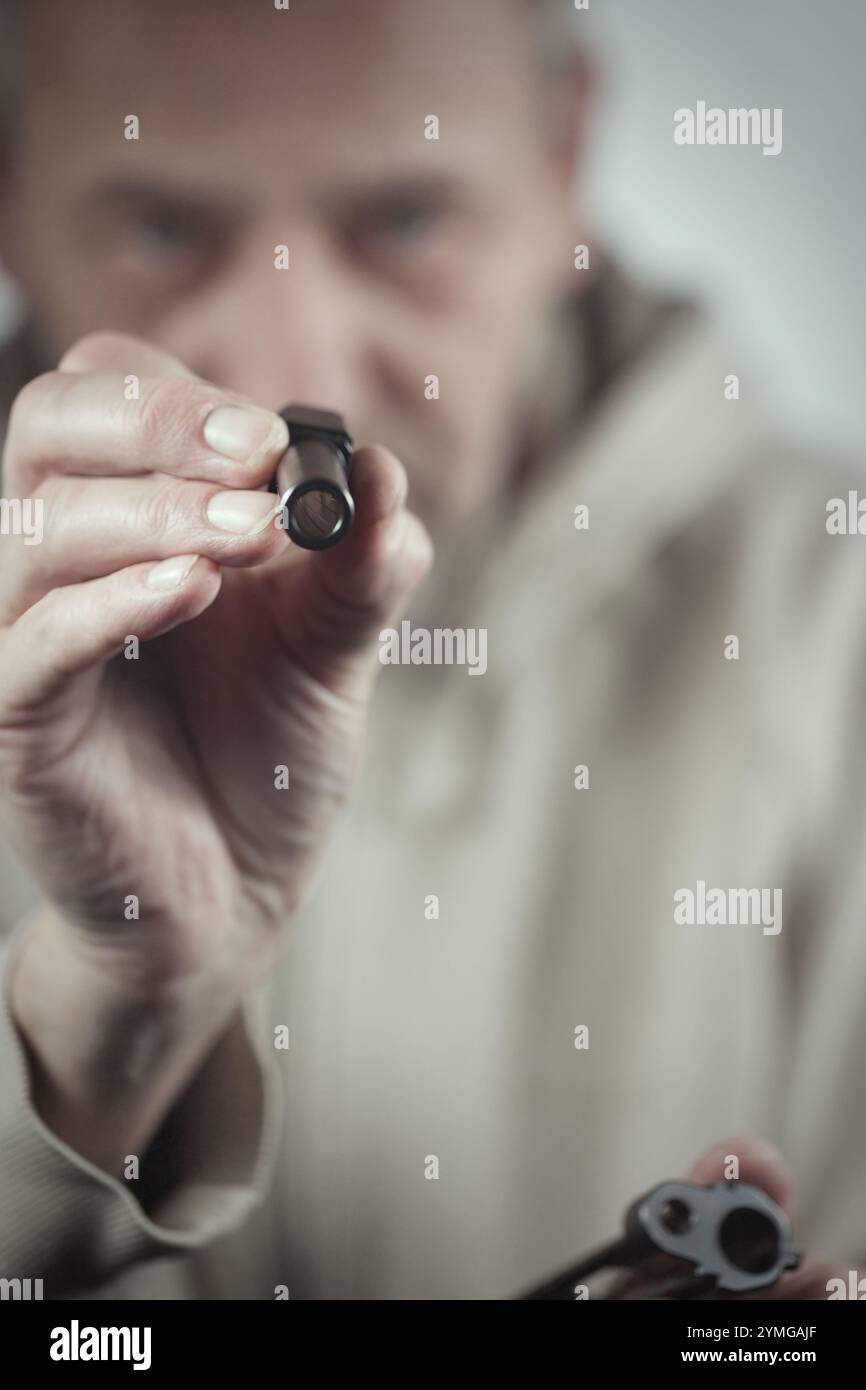 Man take care of semi automatic pistol handgun at home Stock Photo - Alamy