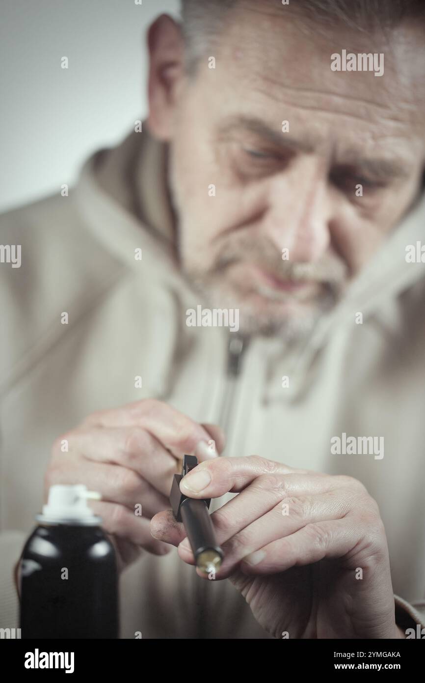Man take care of semi automatic pistol handgun at home Stock Photo - Alamy
