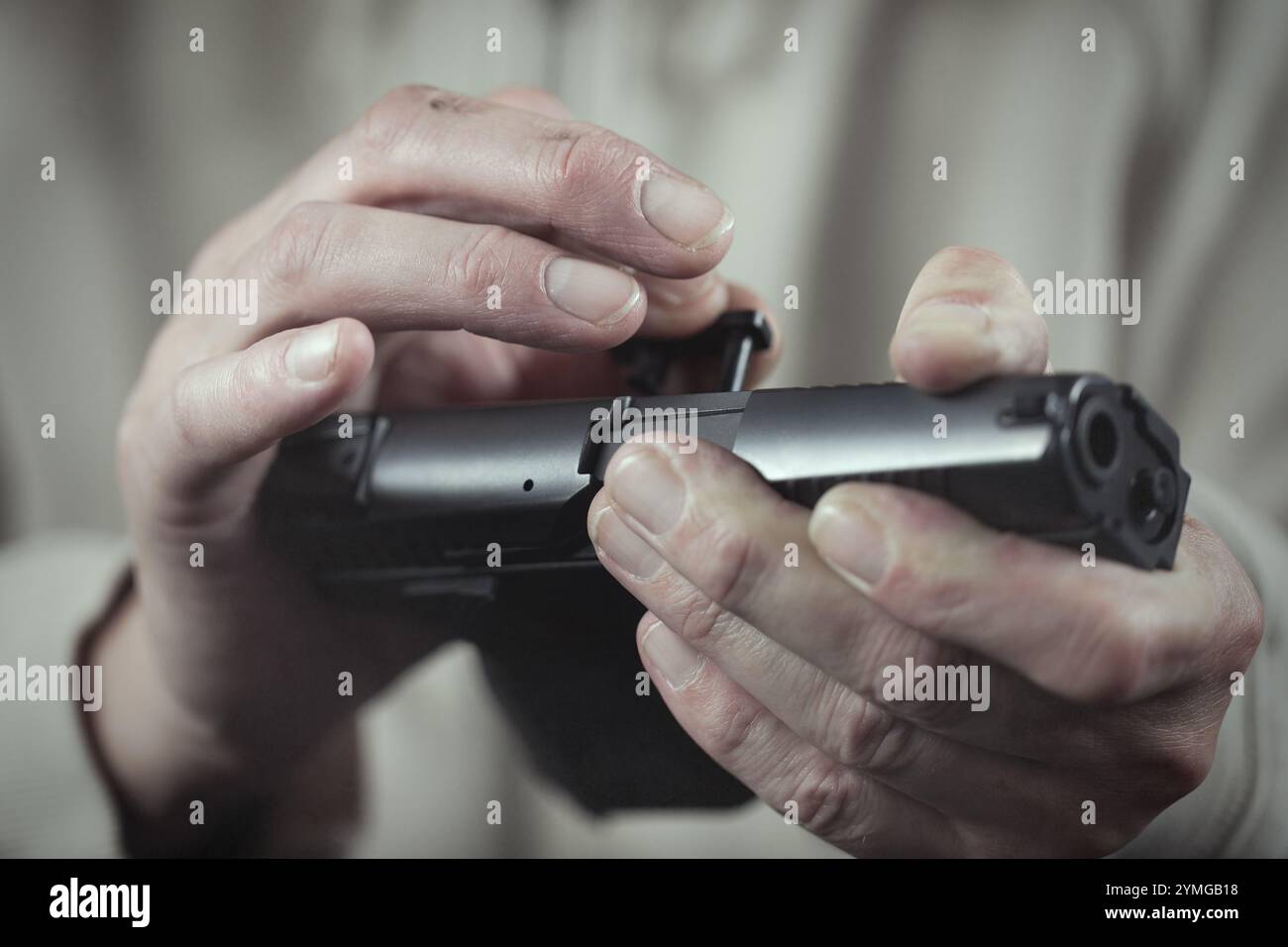 Man take care of semi automatic pistol handgun at home Stock Photo - Alamy
