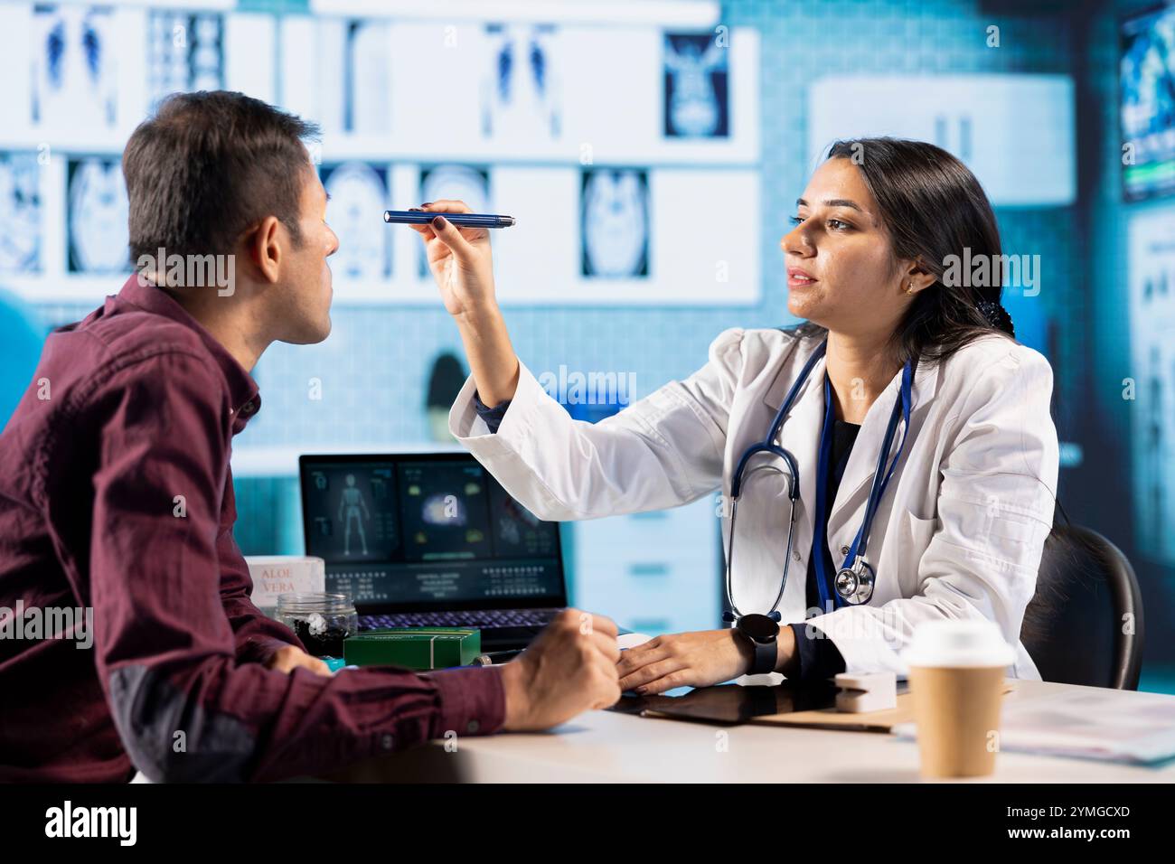 Optometrist performing a vision test in a modern clinical office ...