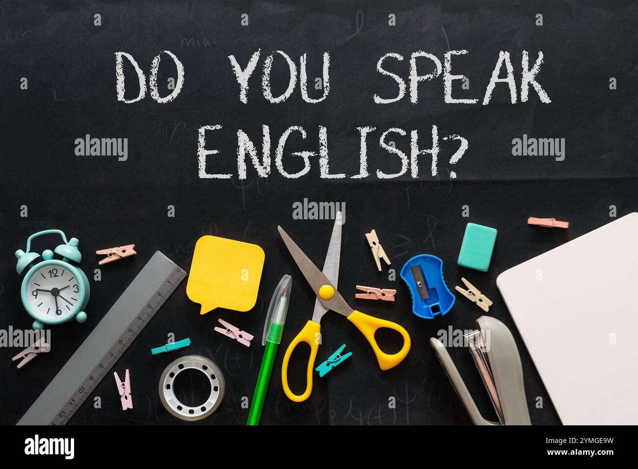 Chalkboard with the words Do you speak English written on it. The ...