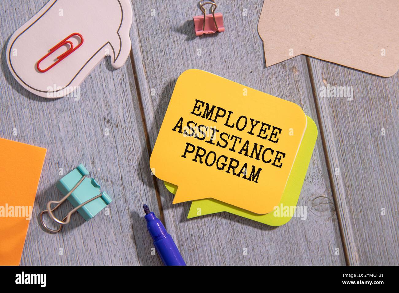 Employee Assistance Program text on paper torn with compass and magnifying glass on paper craft ...