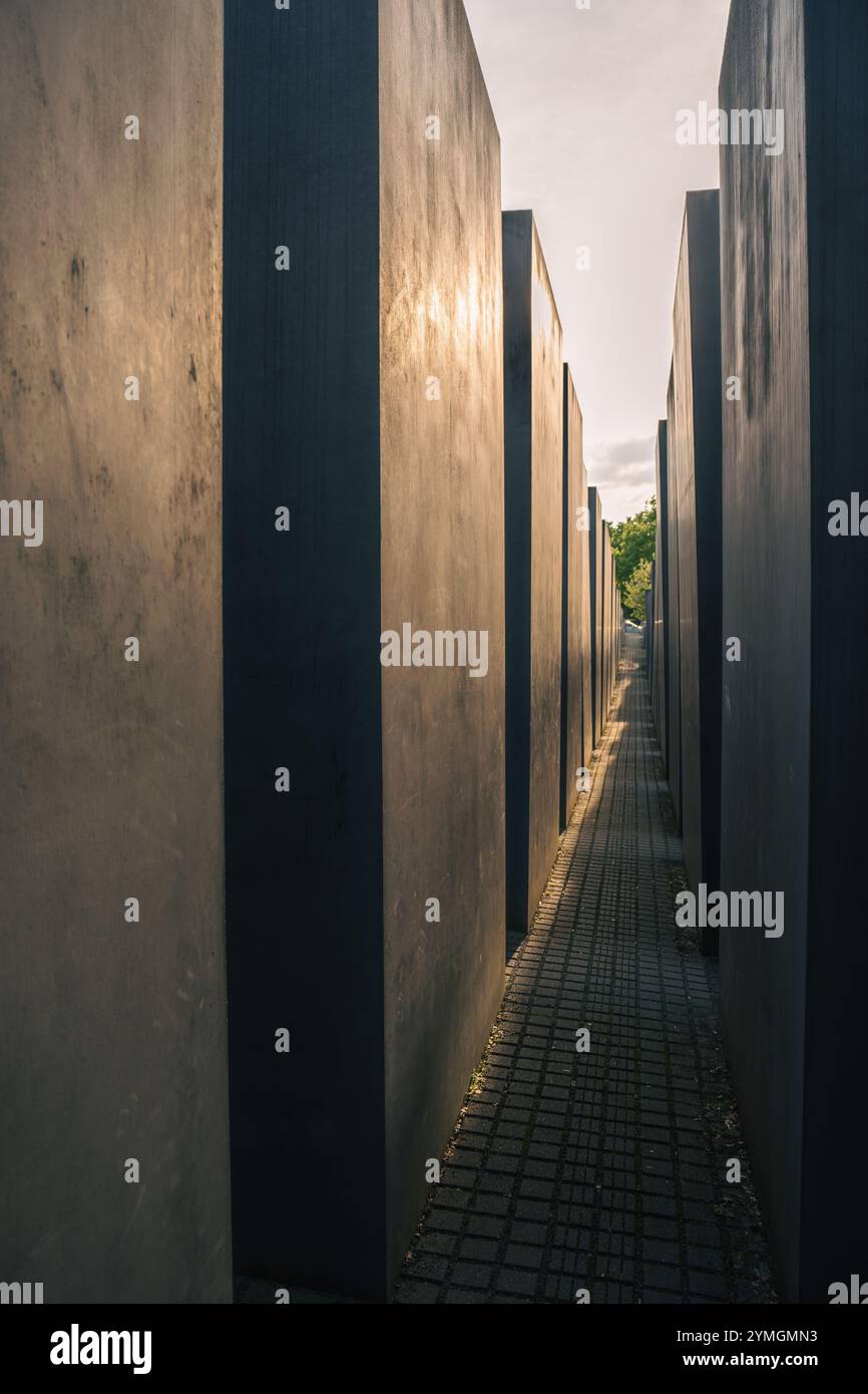 A straight line of sturdy concrete columns leading up to a large ...