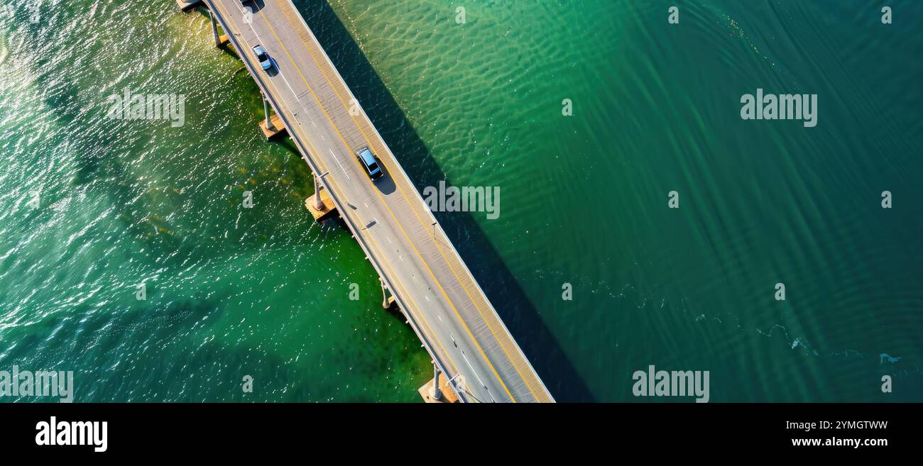 Aerial view of a beautifully designed bridge, with cars driving over it ...
