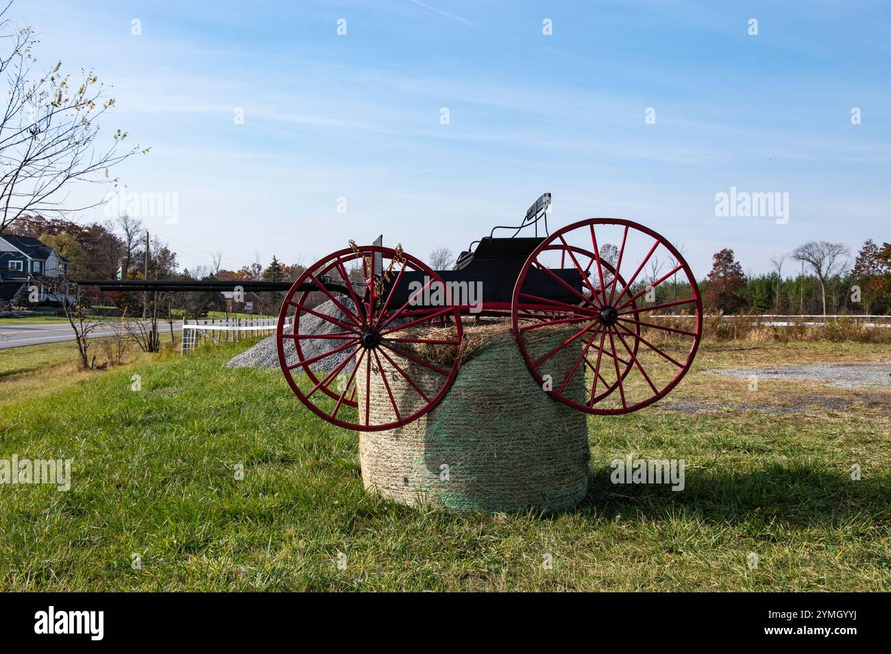 Vintage carriage on a hay bale displayed at Warner Ranch and Pumpkin ...