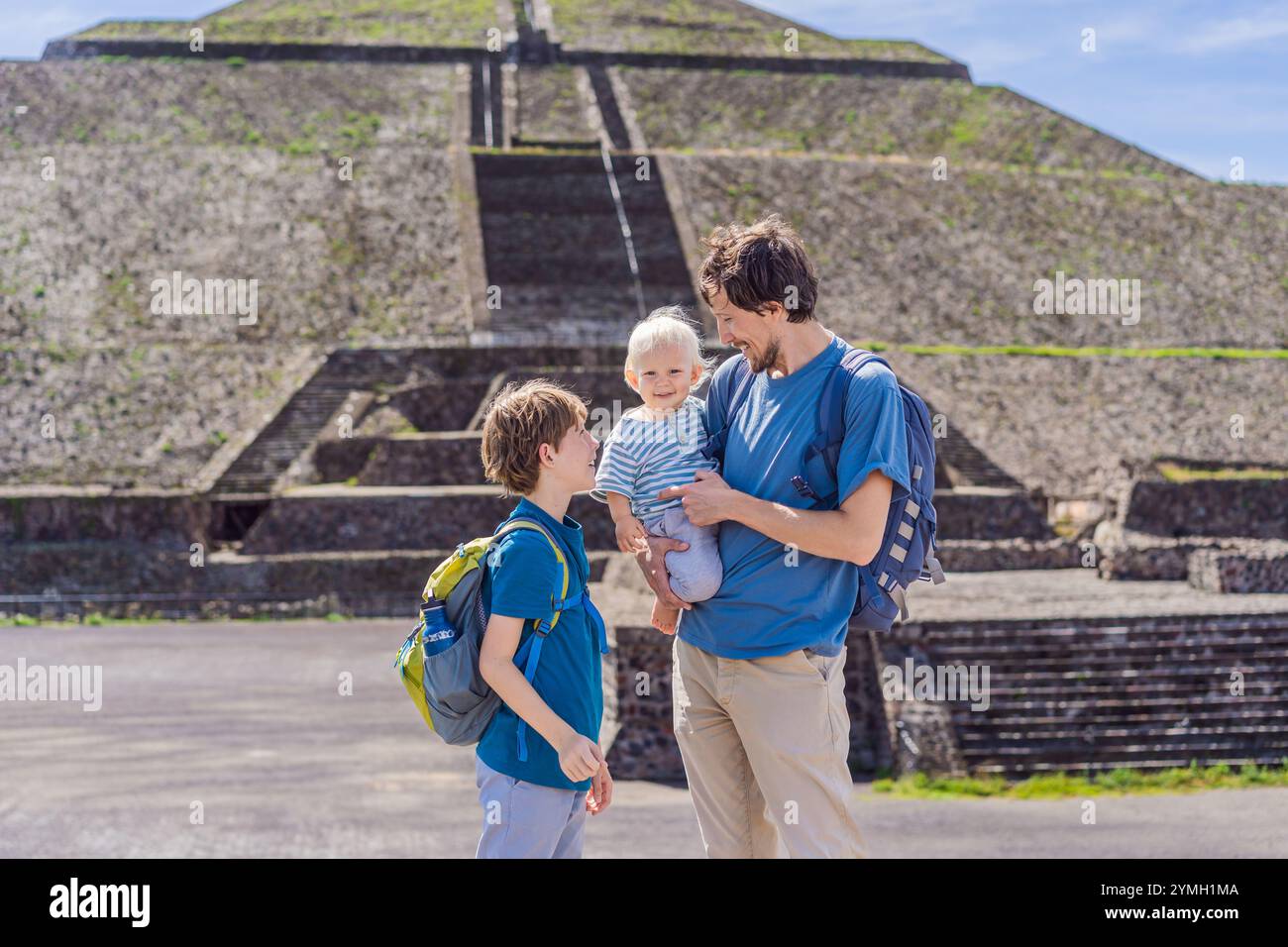 Father with his toddler and teenage sons exploring Teotihuacan, Mexico ...