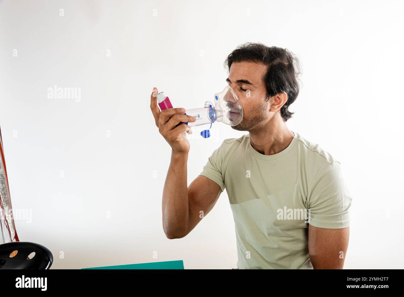 Young man using a respiratory inhaler Stock Photo - Alamy