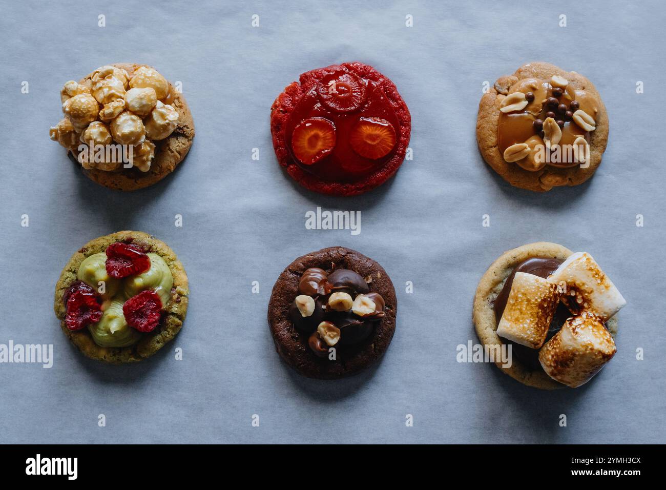 Collection of homemade round cookies with different toppings ...