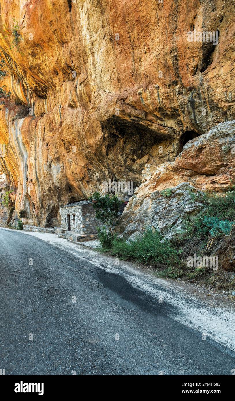 The small stone Church of Saint Michael sits nestled beside a rugged ...