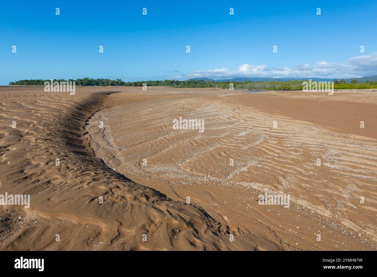Scenic view of sand patterns at low tide at Carmila Beach, Queensland ...