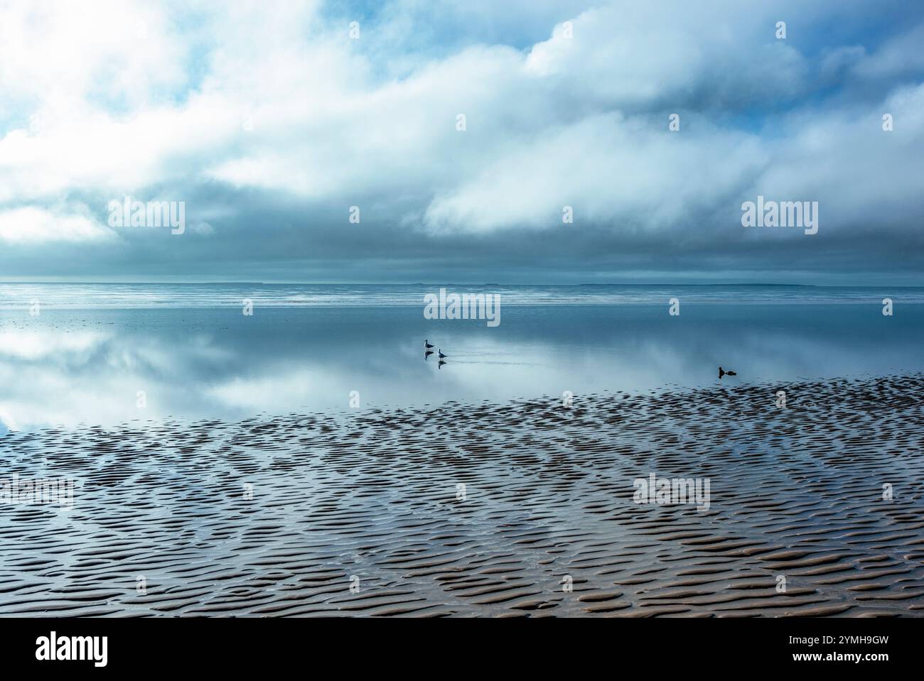 Sand patterns and low clouds at low tide at Carmila Beach, Queensland ...