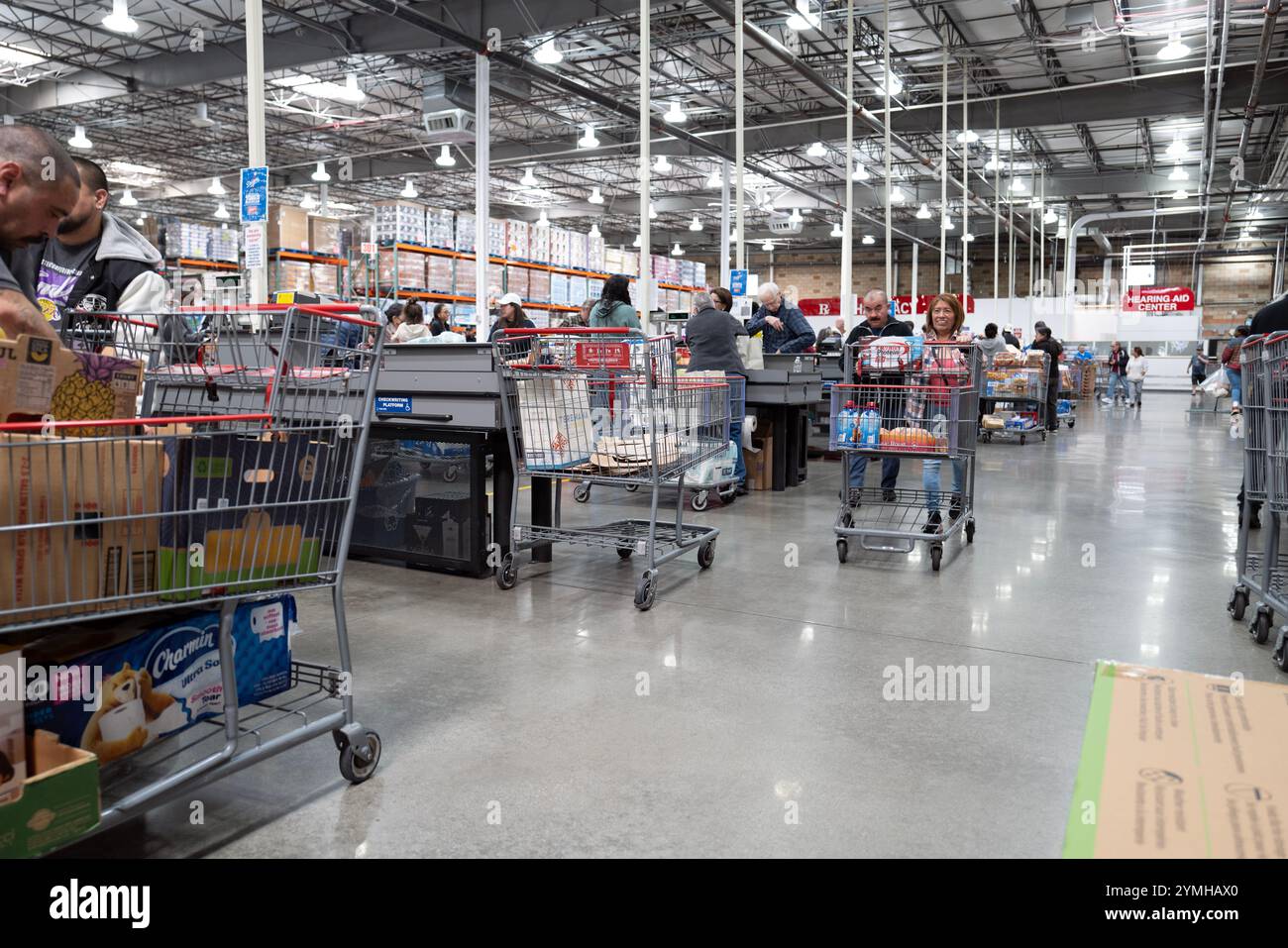 Images of a bustling Costco store featuring the exterior, entrance, and ...