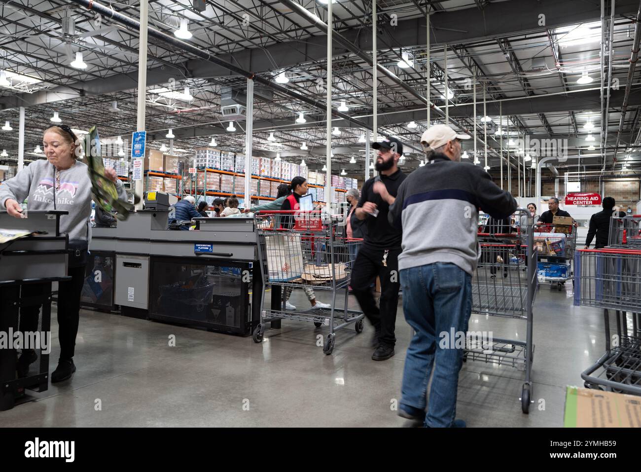 Images of a bustling Costco store featuring the exterior, entrance, and checkout areas ...
