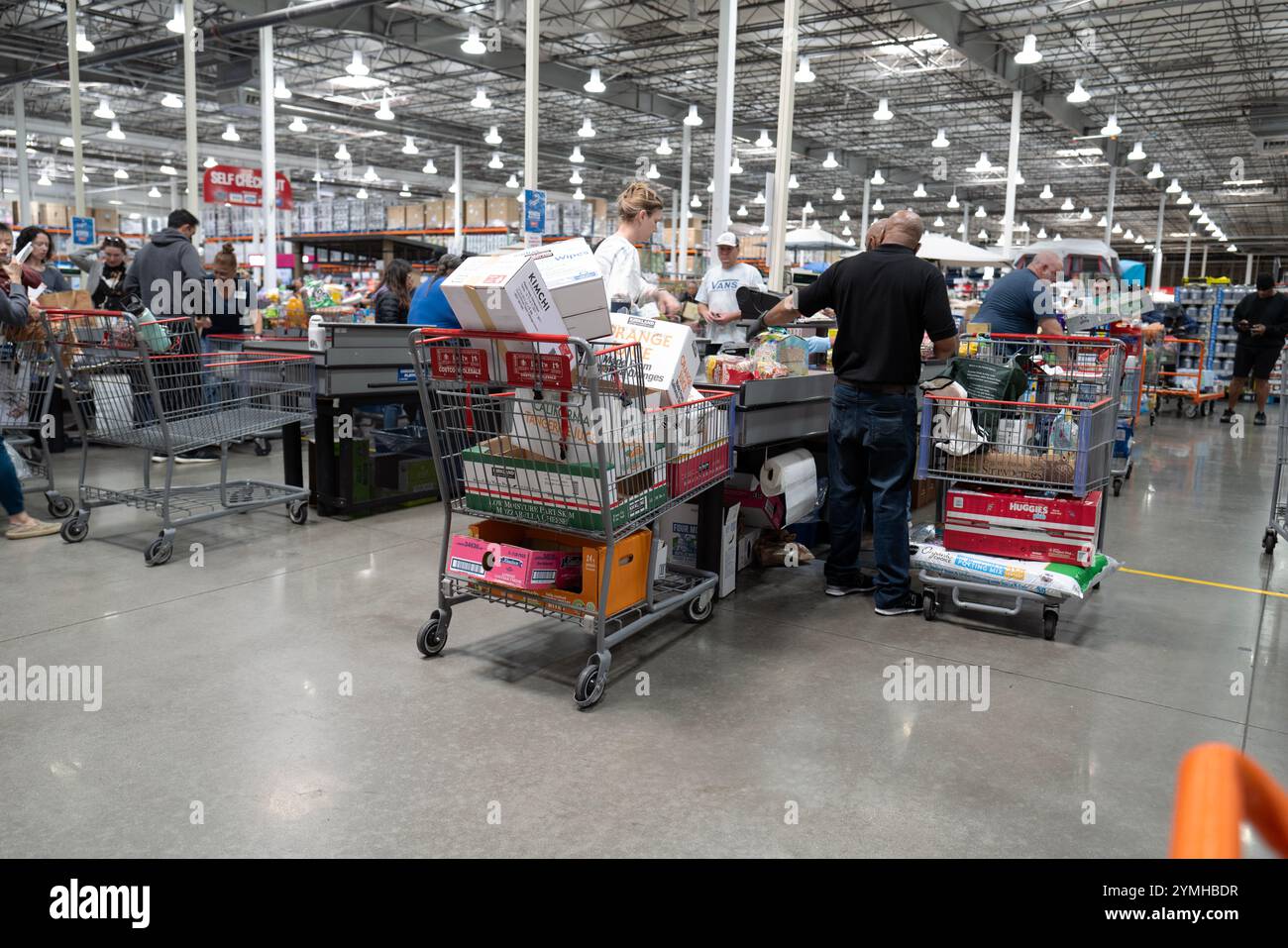 Images of a bustling Costco store featuring the exterior, entrance, and ...