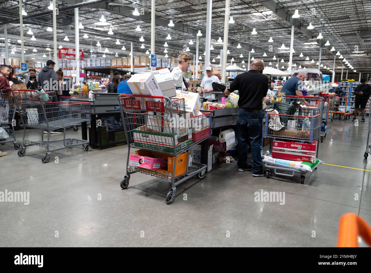 Images of a bustling Costco store featuring the exterior, entrance, and ...