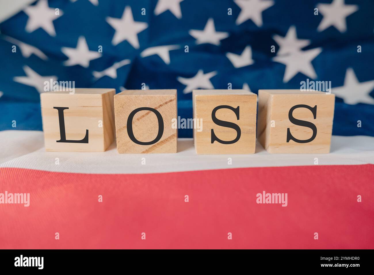 Wooden block with the word loss written on it. The block is placed on ...