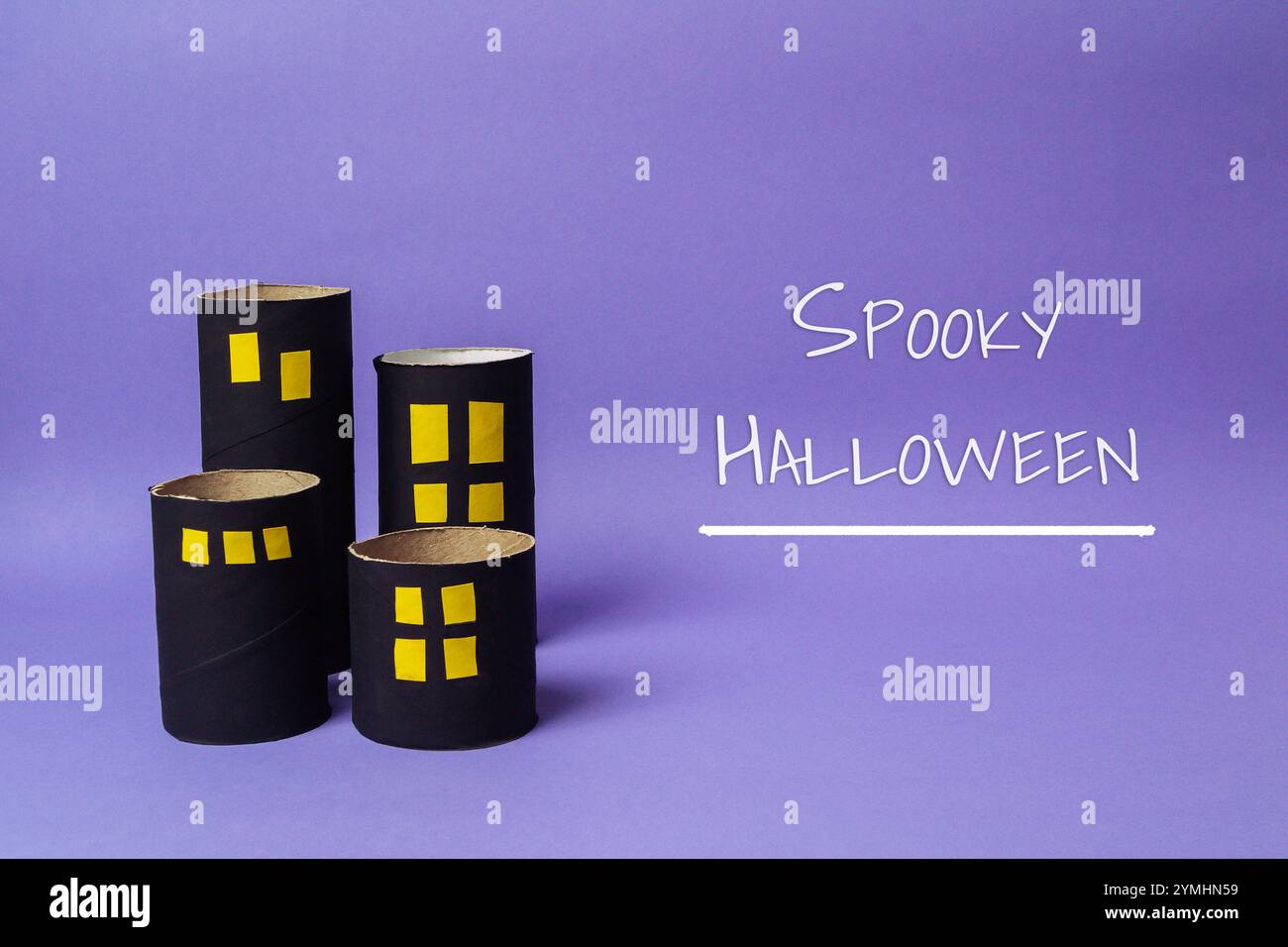 Group of cardboard houses are on a purple background with the words ...