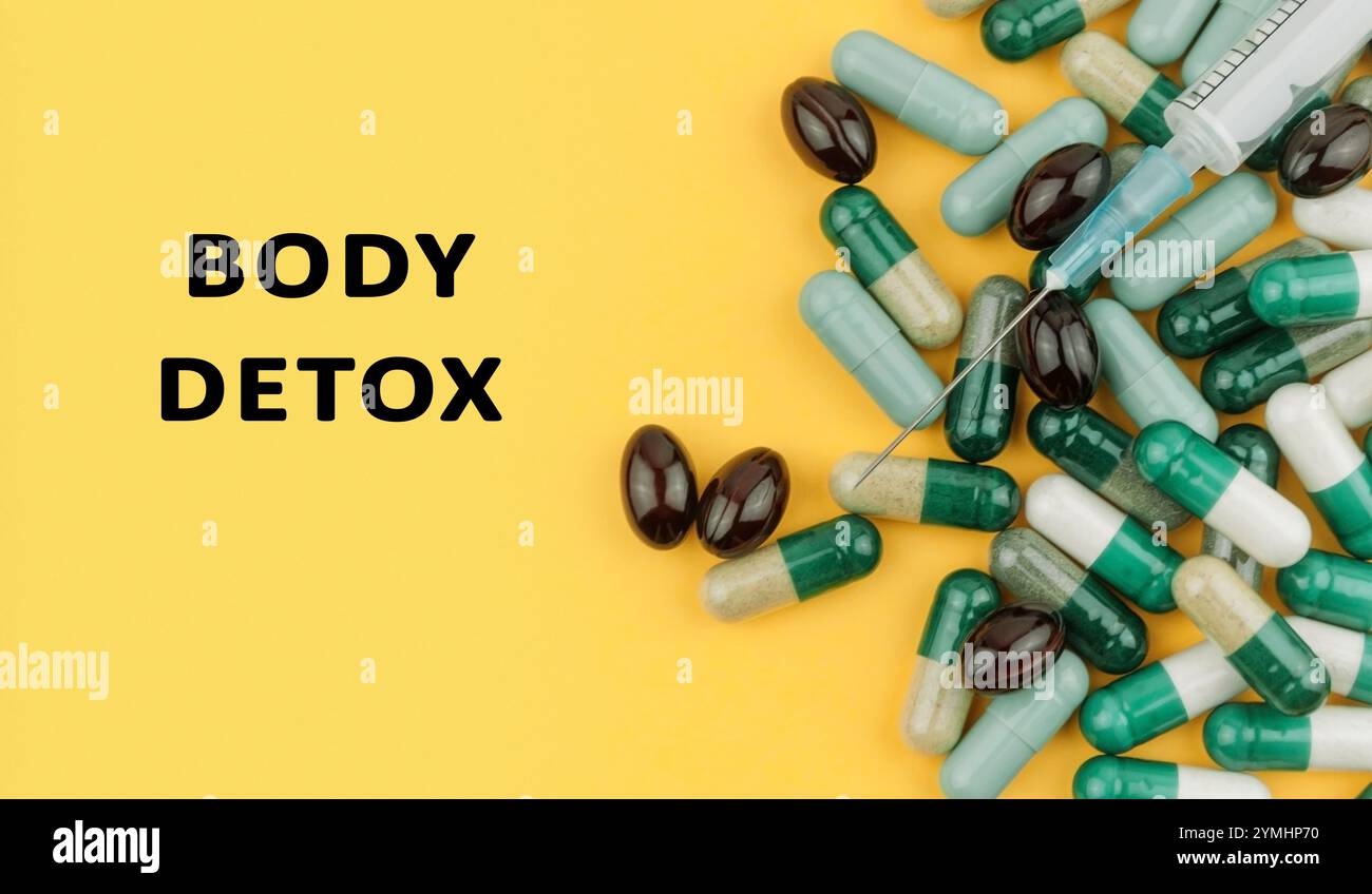 Bunch of pills with a syringe on top of them and the words body detox ...