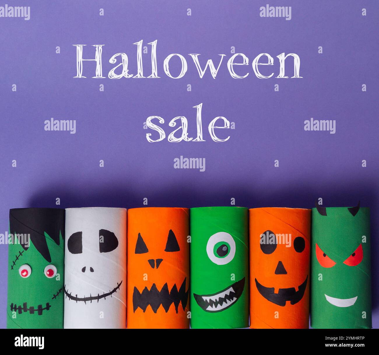 Bunch of Halloween themed paper tubes with faces on them. The tubes are ...
