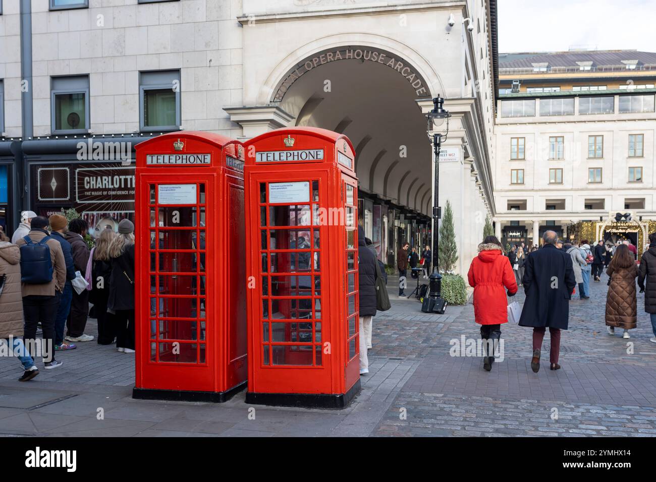 London, UK - November 19, 2024. Red telephone booths near Covent Garden ...