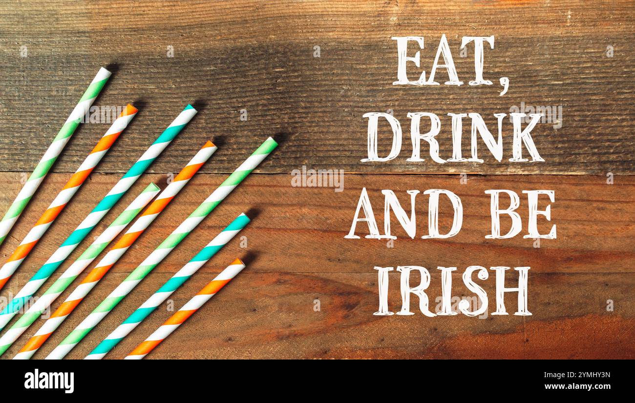 Wooden table with a bunch of straws on it and the words Eat, Drink and ...