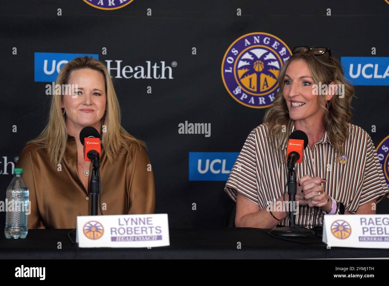 Lynne Roberts (left) is introduced as the LA Sparks basketball coach by ...