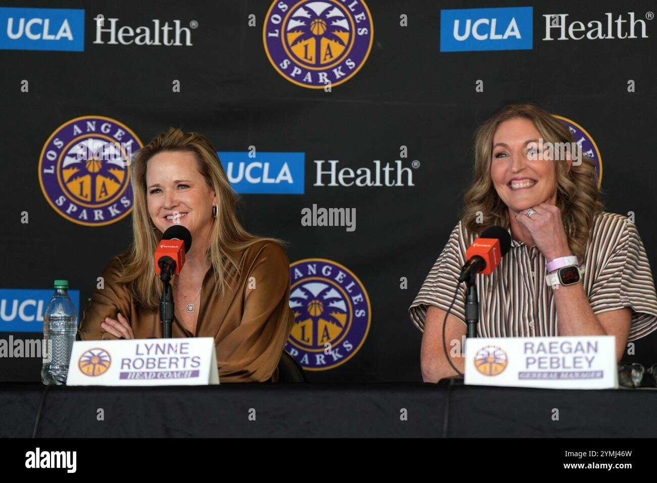 Lynne Roberts (left) is introduced as the LA Sparks basketball coach by ...