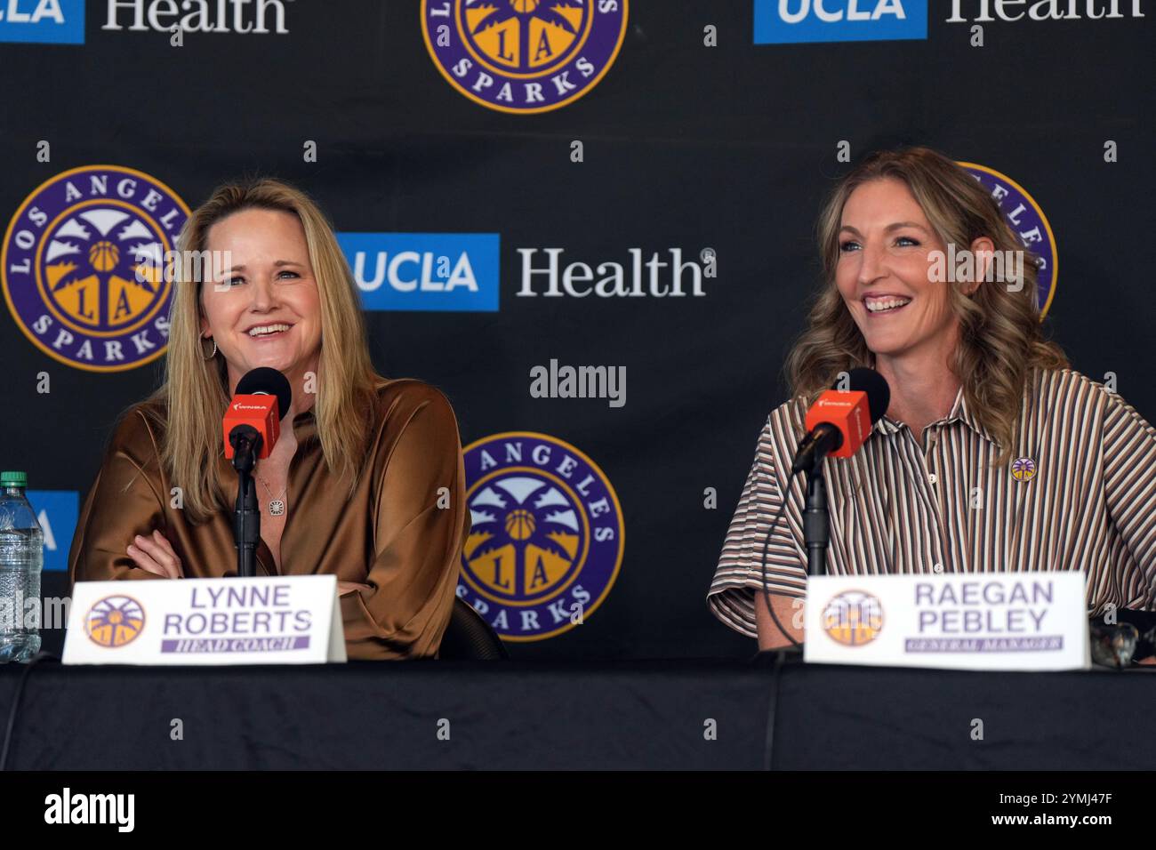 Lynne Roberts (left) is introduced as the LA Sparks basketball coach by ...