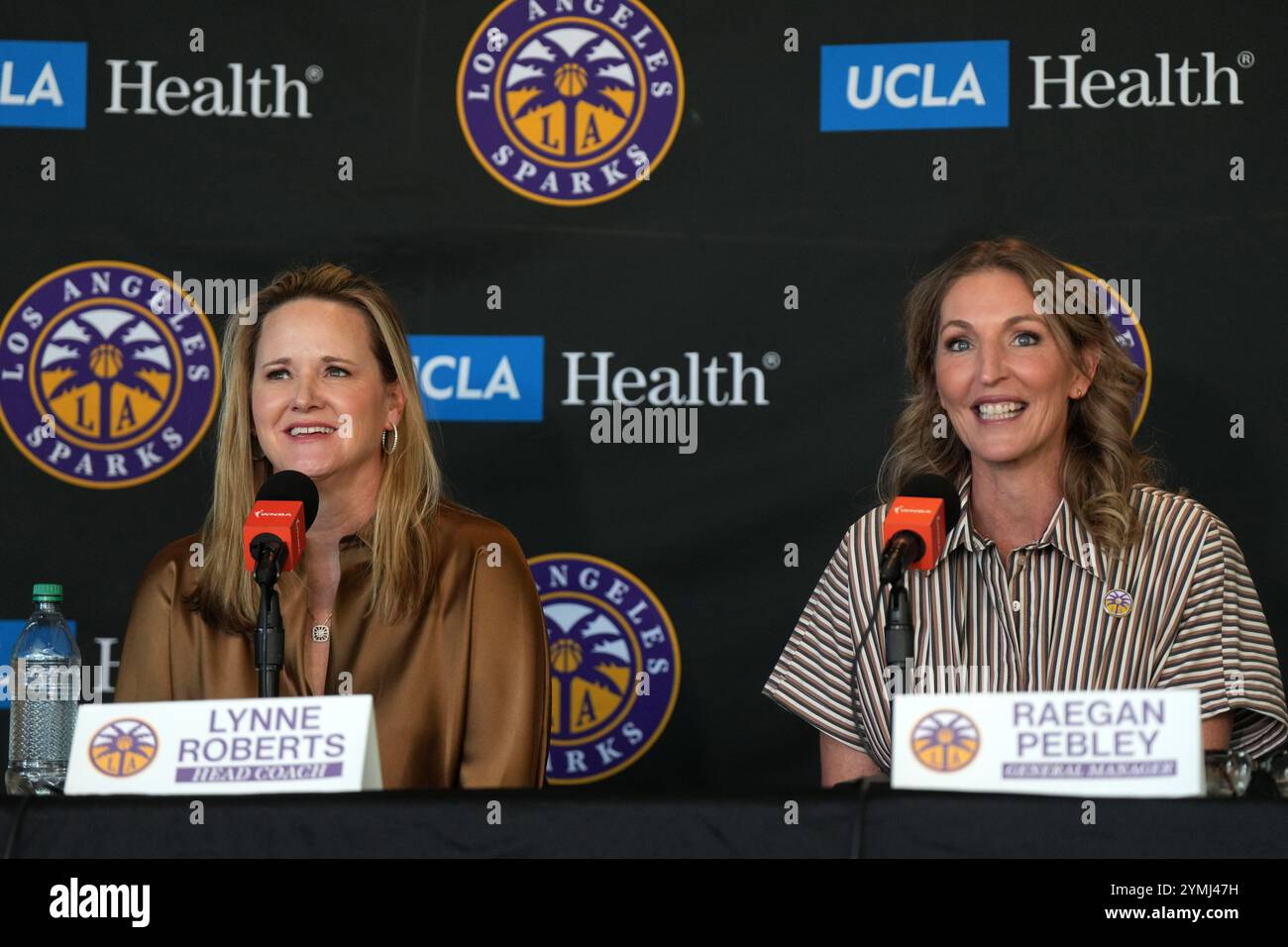Lynne Roberts (left) is introduced as the LA Sparks basketball coach by ...