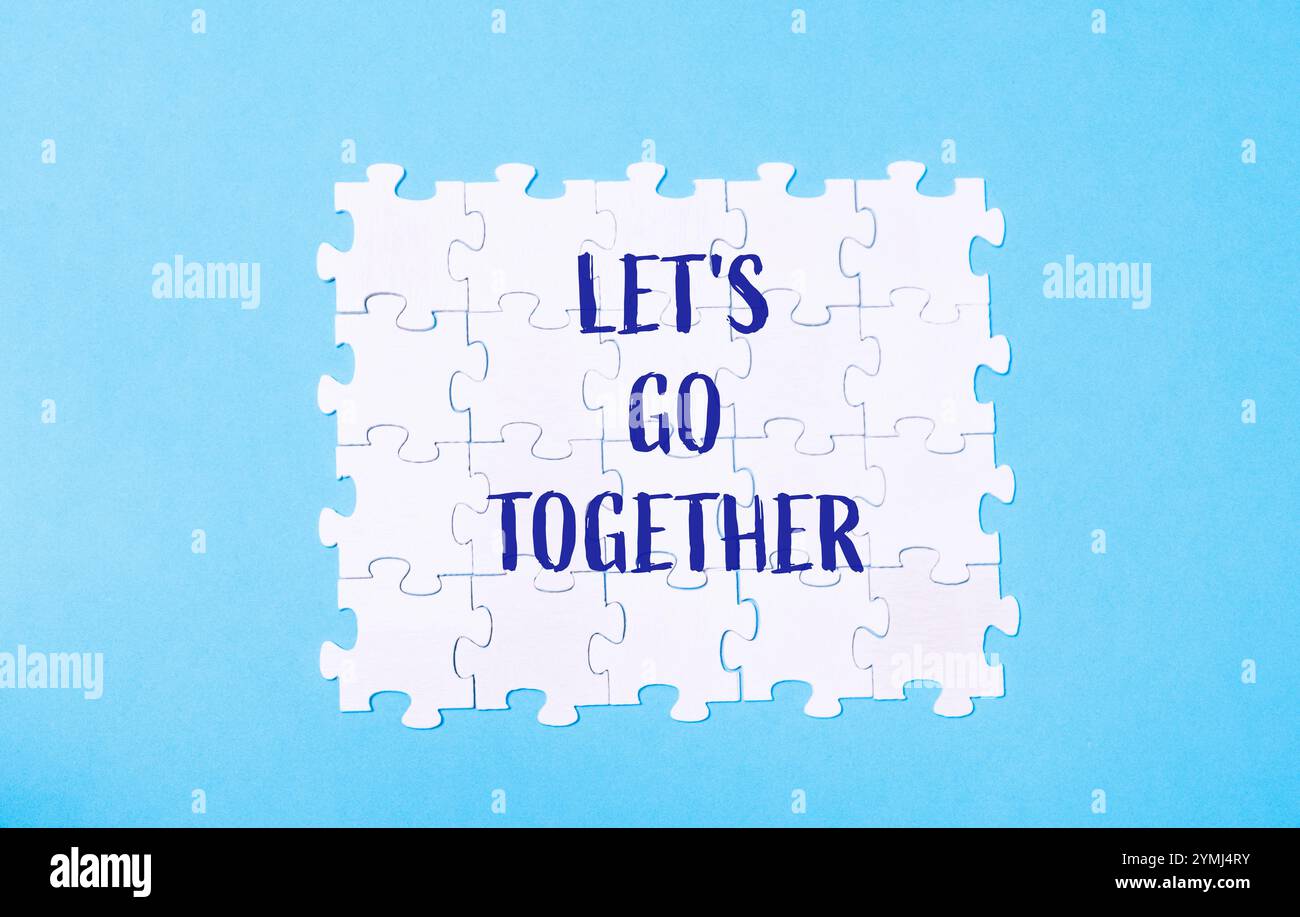 Puzzle with the words Let's go together written on it. The puzzle is ...