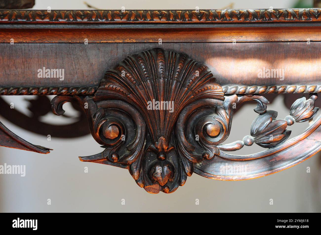 Antique furniture with ornate wood carving featuring floral and shell ...