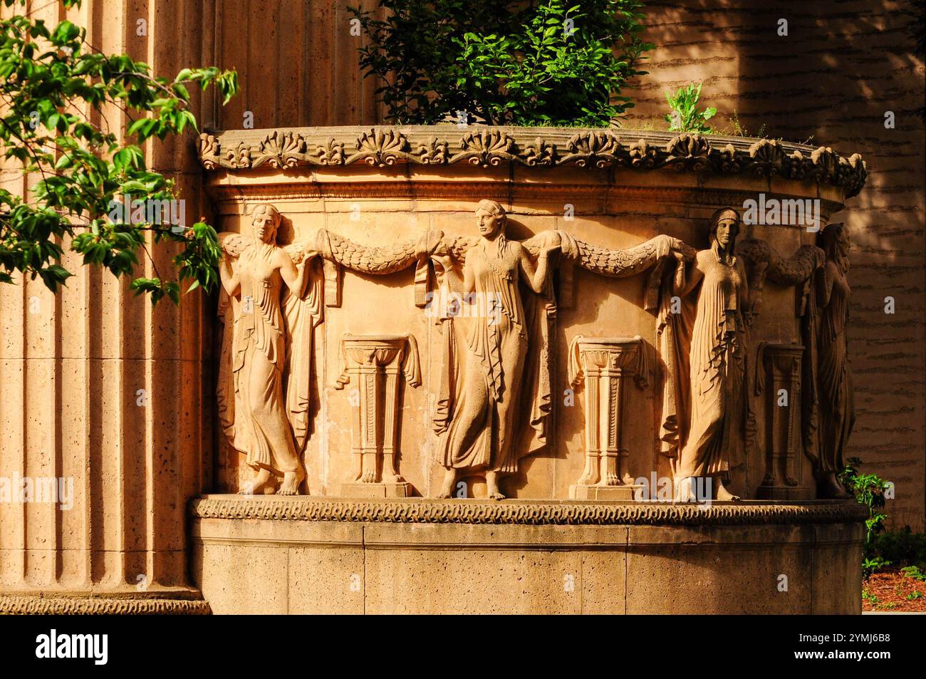 Ornate stone carvings of draped figures on a historical column Stock ...