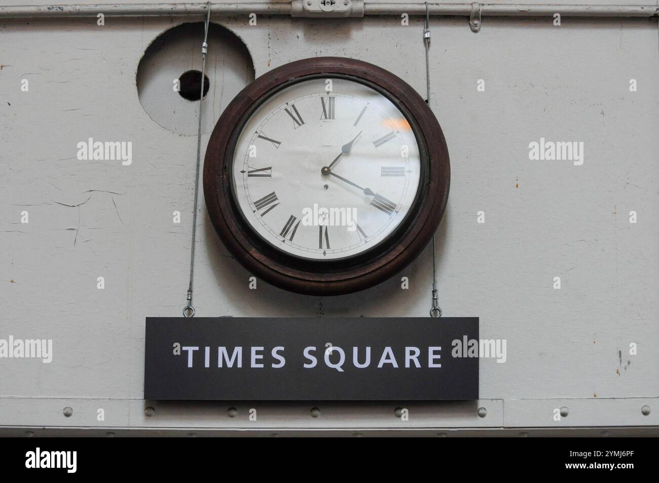 Wall clock with Roman numerals above 'Times Square' sign, timeless ...