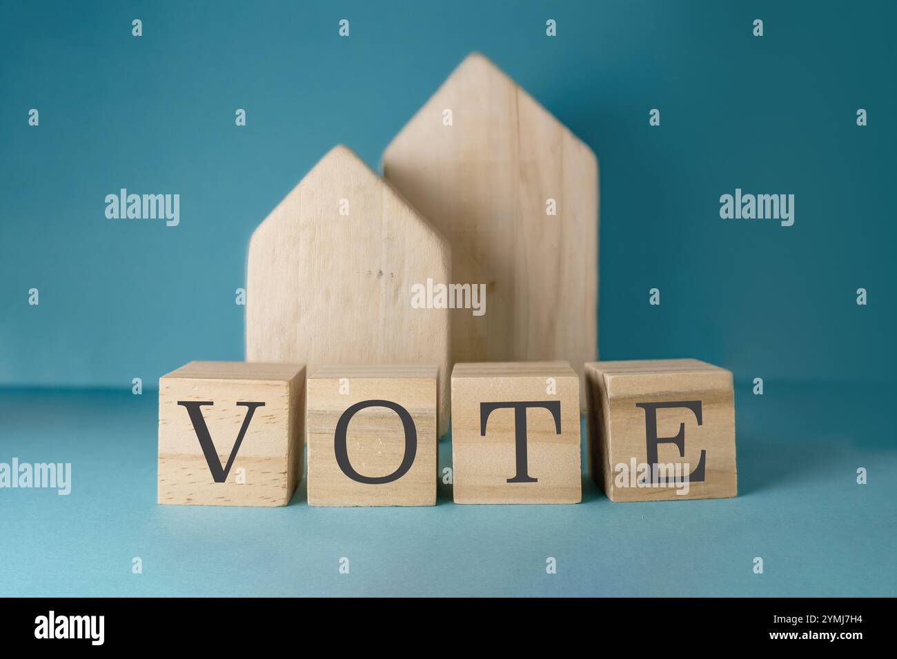 Wooden block with the word Vote written on it Stock Photo - Alamy