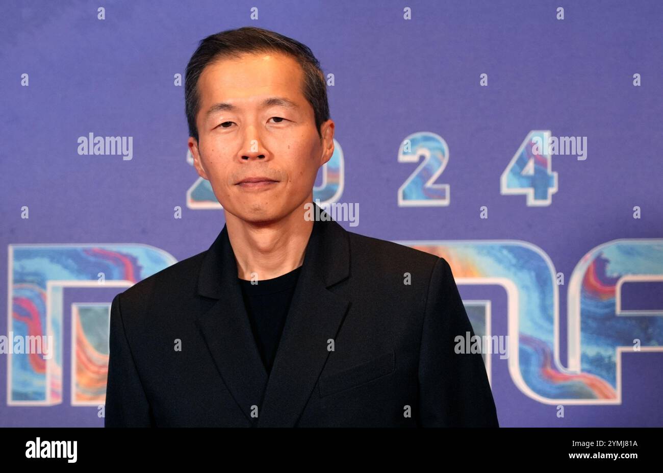 Filmmaker Lee Isaac Chung poses backstage at the MAMA Awards on ...