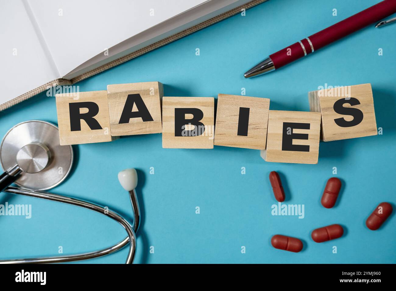 Wooden block with the word rabies written on it Stock Photo - Alamy