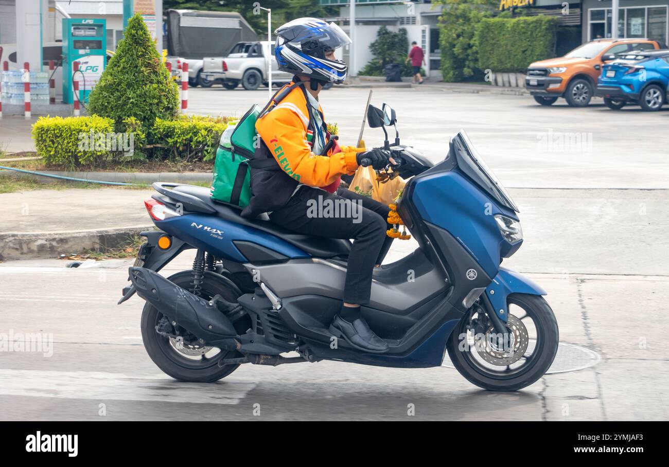 BANGKOK, THAILAND, MAR 09 2024, A employee of a retail chain delivers ...