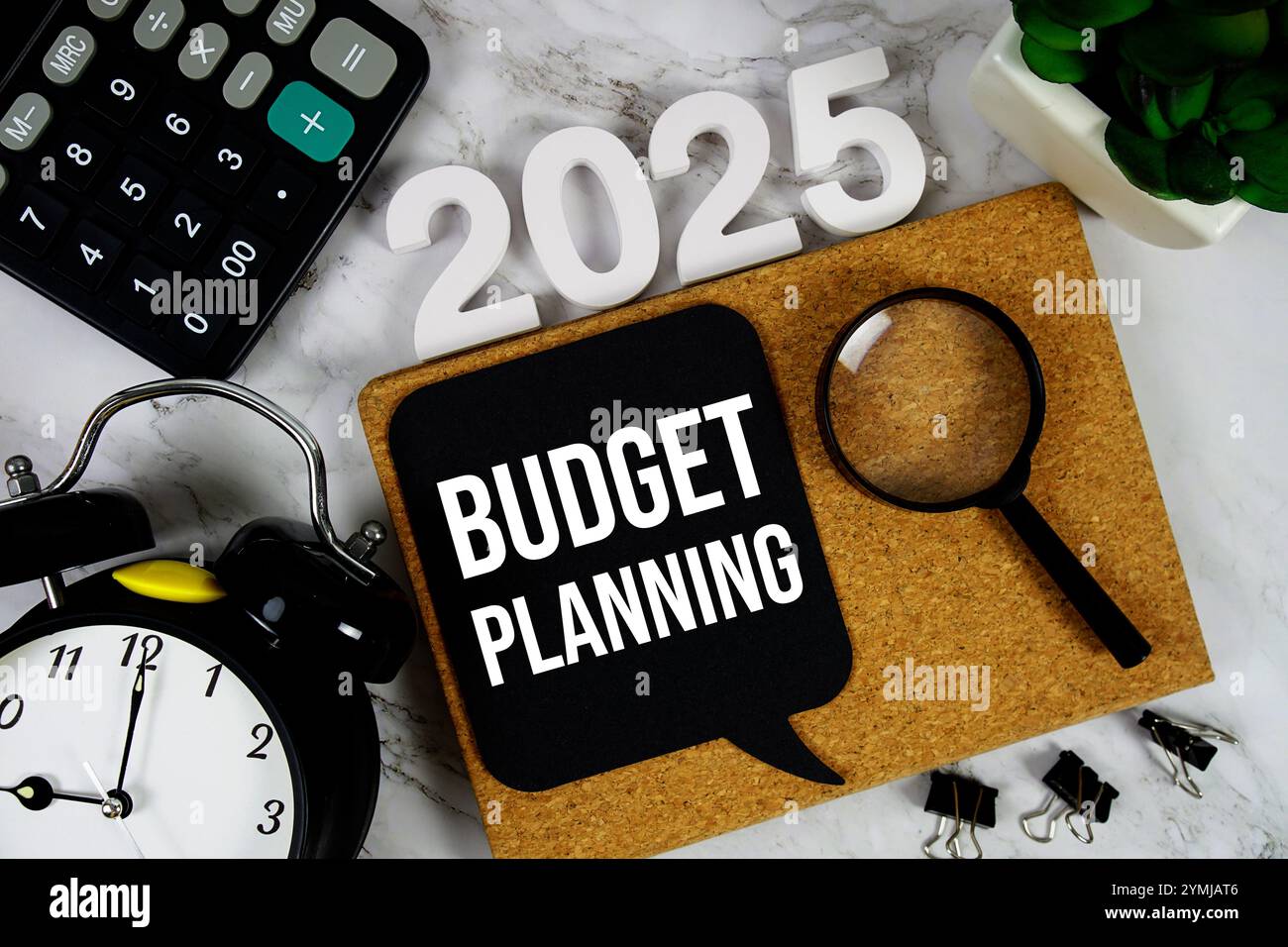 Budget Planning 2025 text message with calculator, alarm clock and ...