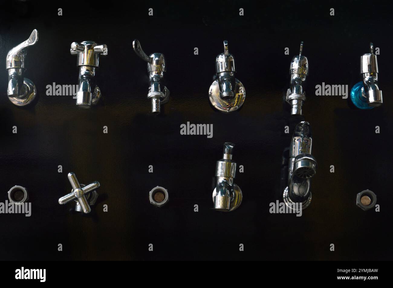 display or examples of water tap on store Stock Photo - Alamy