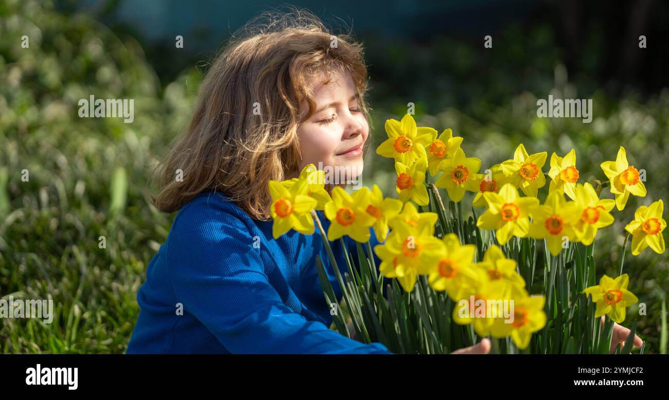 Kid in spring cherry blossom park. Happy childhood. Spring holidays ...