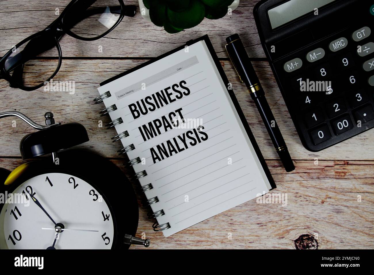 Business Impact Analysis (BIA) text on notepad, Business and Financial concept background Stock ...