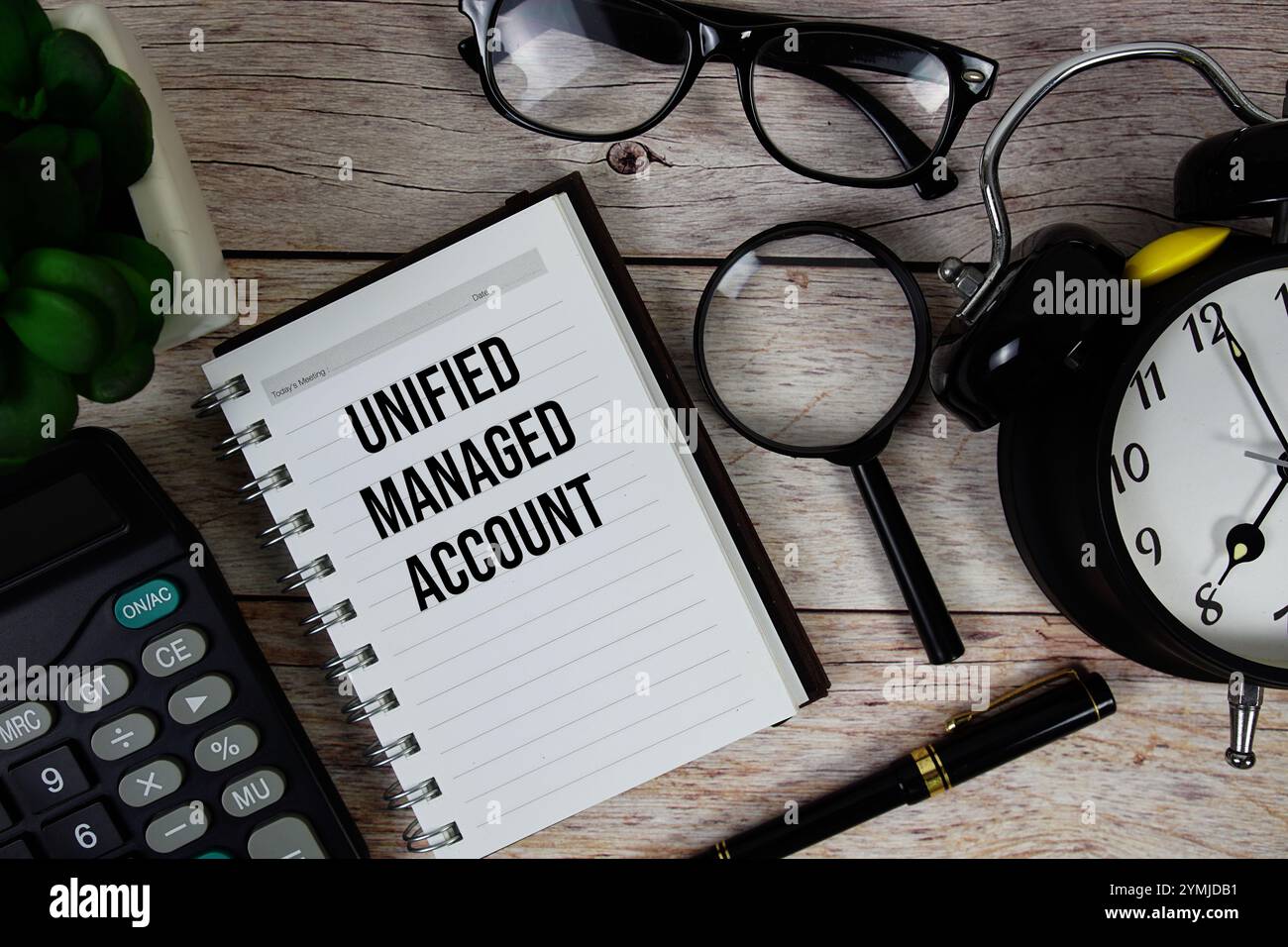 Unified Managed Account (UMA) text on notepad, Business and Financial ...