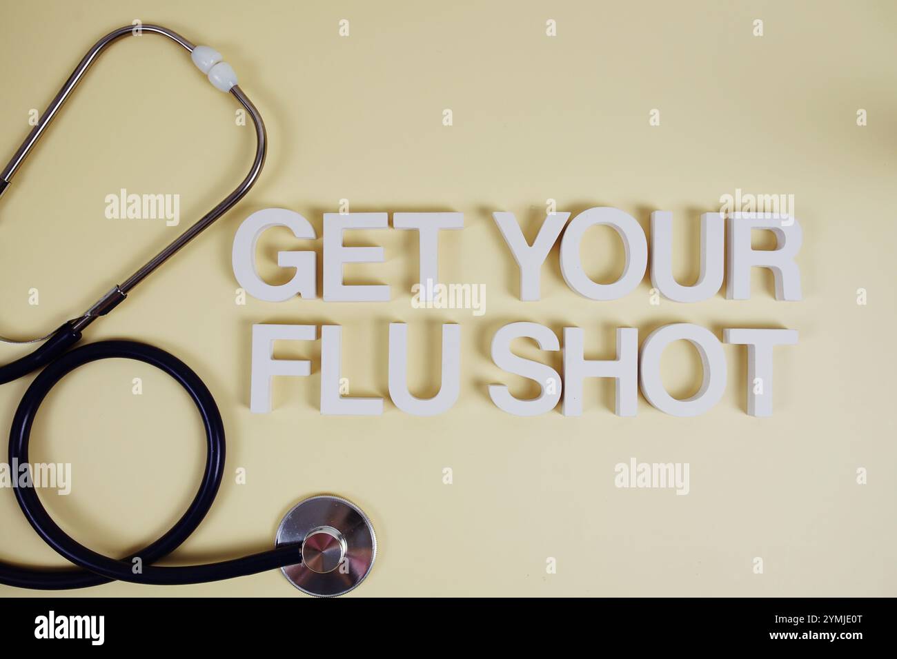 Get Your Flu Shot alphabet letters with stethoscope top view on yellow ...
