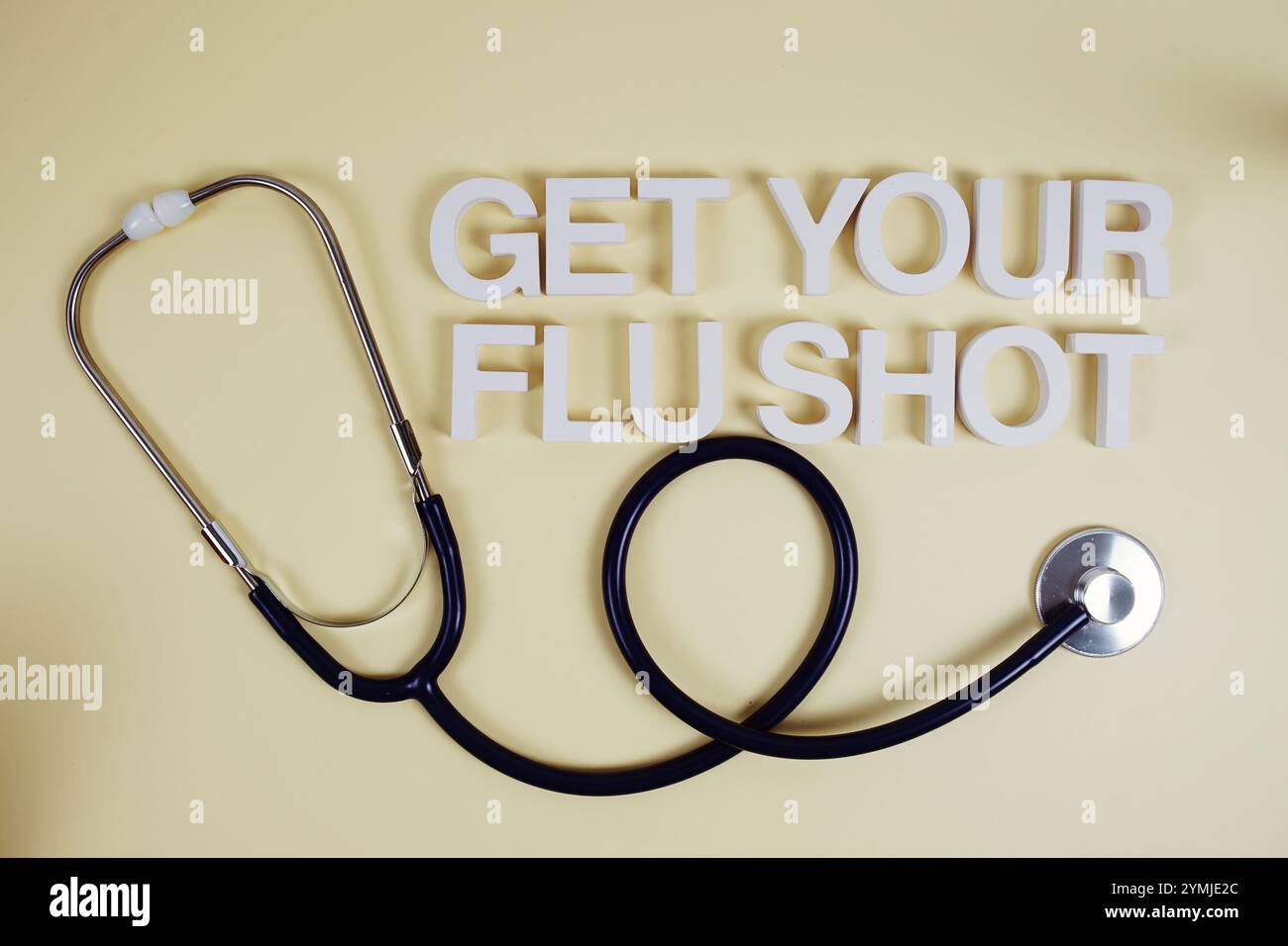Get Your Flu Shot alphabet letters with stethoscope top view on yellow ...