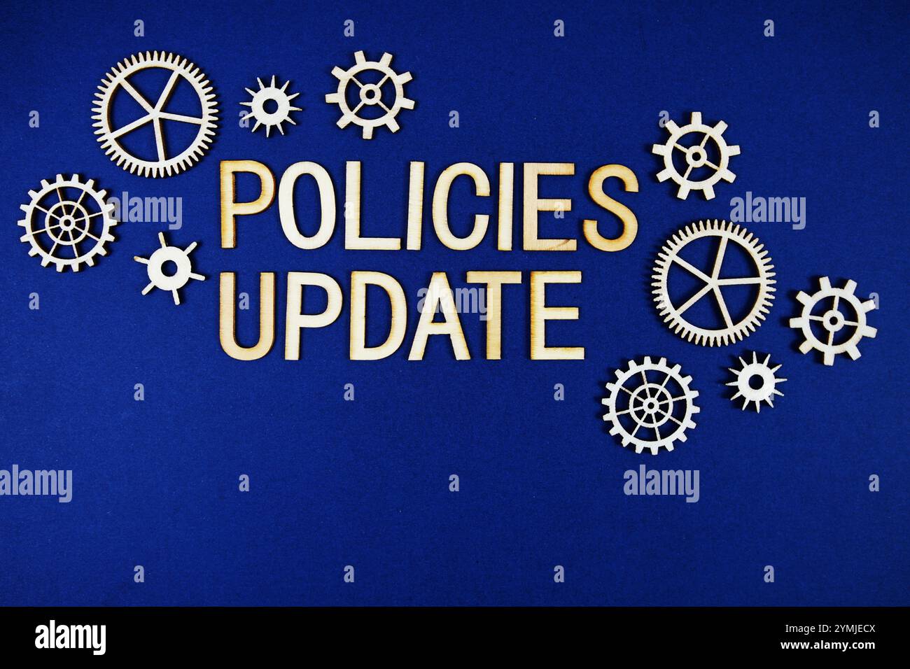 Policies Update alphabet letters with gears element on navy blue background Stock Photo - Alamy