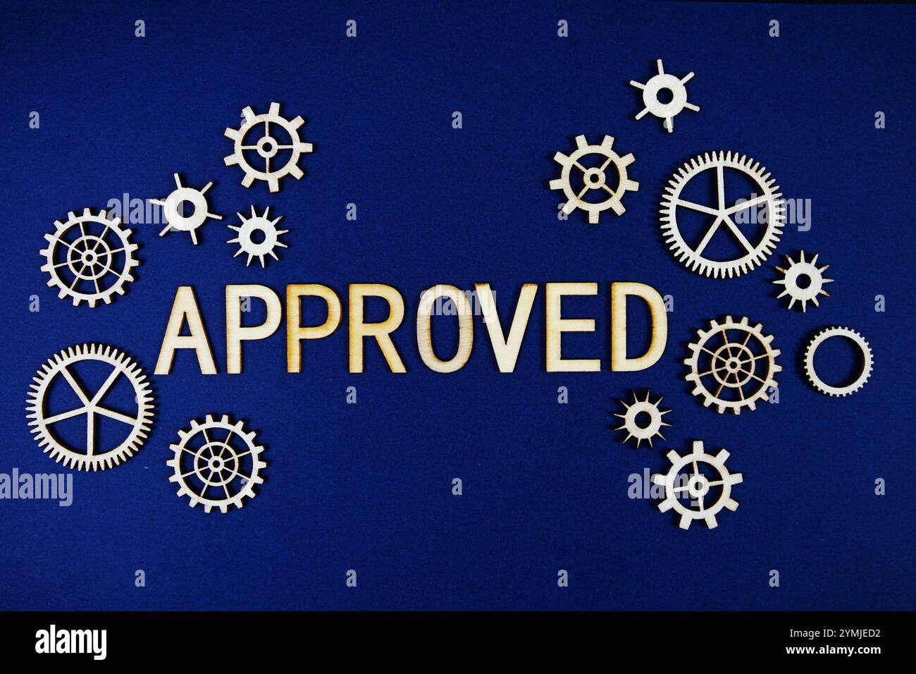 Approved alphabet letters with gears element on navy blue background ...