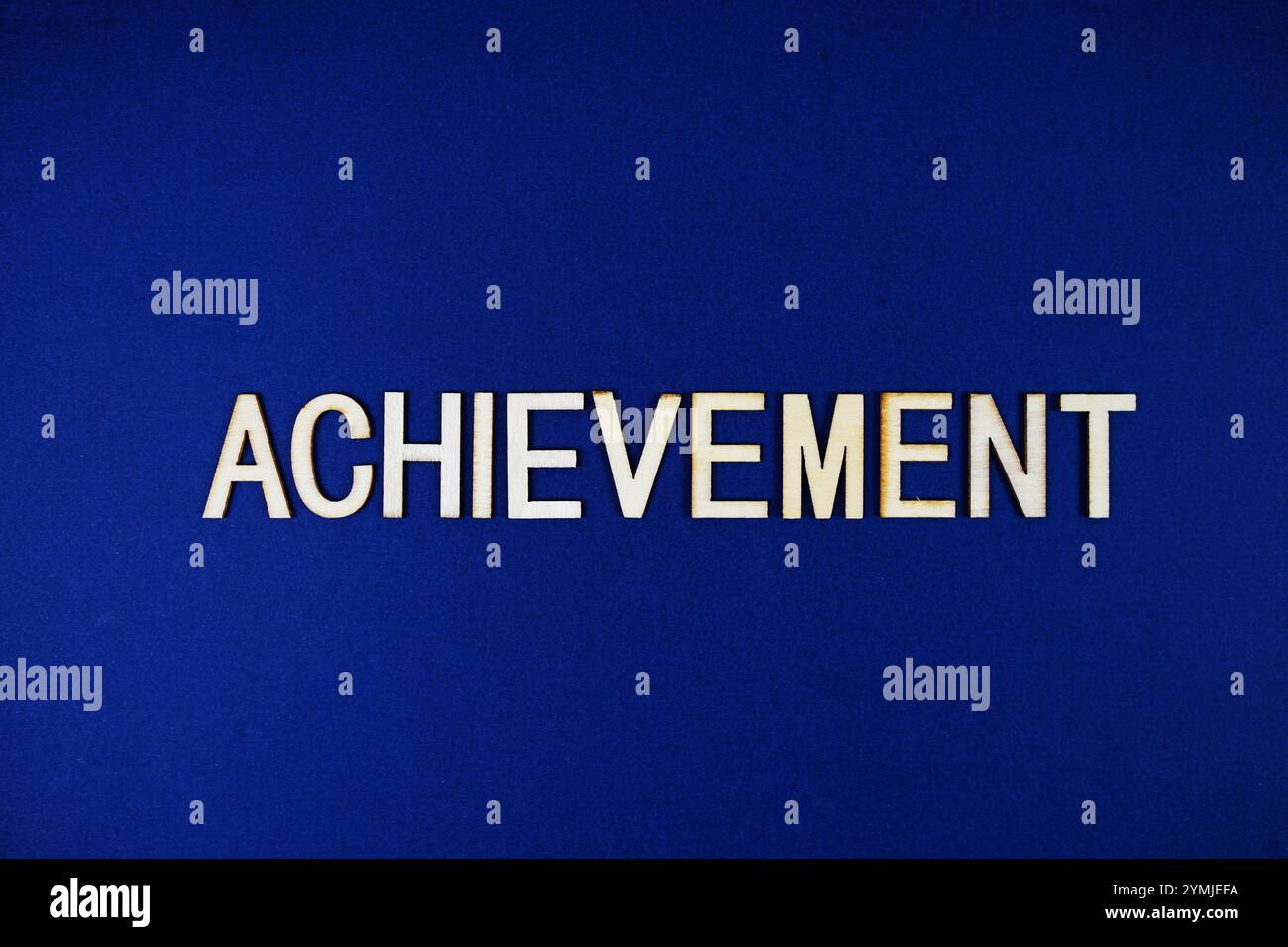 Achievement alphabet letters with gears element on navy blue background ...