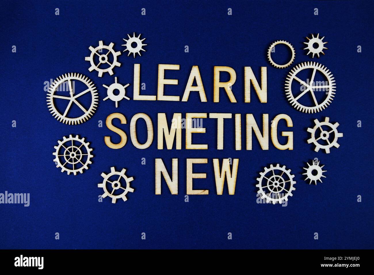 Learn Someting New alphabet letters with gears element on navy blue ...
